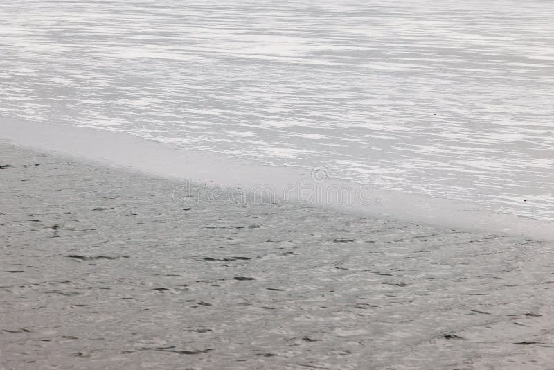 Winter Scene Showing Thin Ice and Fresh Snow at the Side of a Fast ...