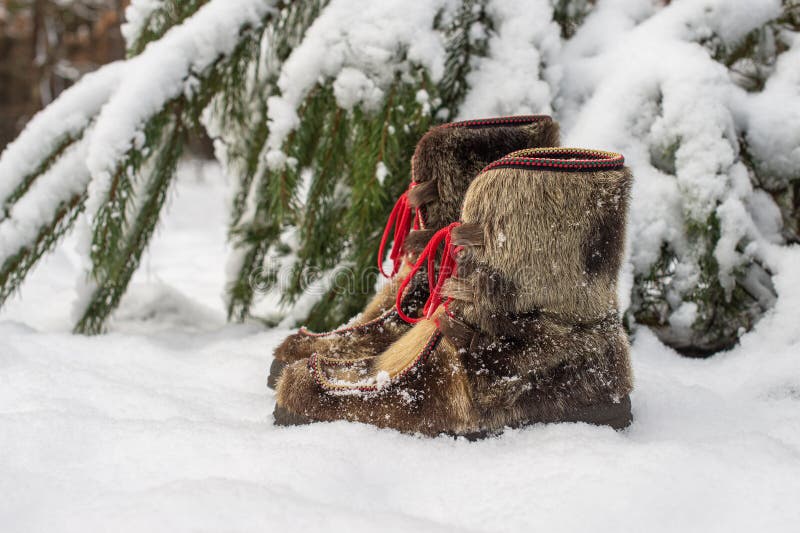 Winter Scene with Snow Boots Made of Reindeer Skin Stock Photo - Image ...