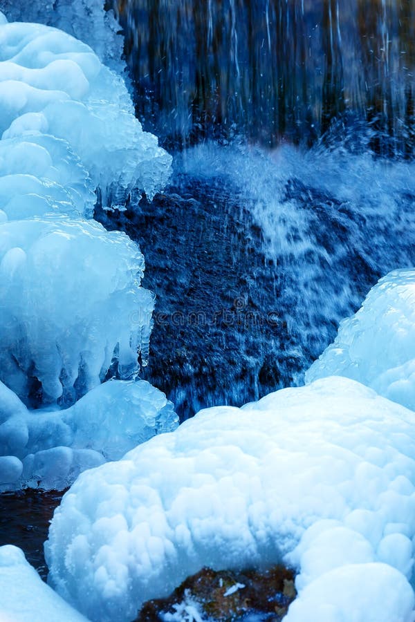 Winter Scene with Water Falling from Icy Rocks. Blue Color. Stock Image ...