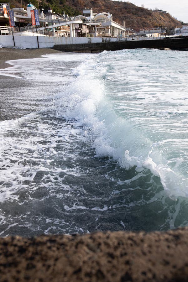 Winter Sea, a Wave Runs Over the Beach in Yalta. Stock Photo - Image of ...