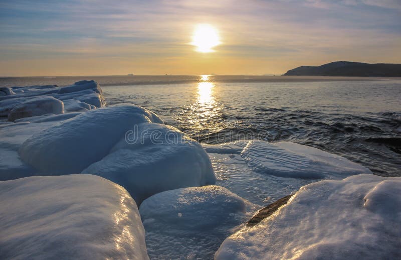 Winter seascape at sunset stock image. Image of shore - 49993609