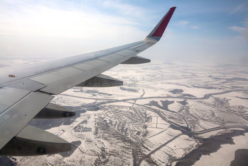 Winter. Snow and Ice Expanses Under the Wing of the Aircraft Stock ...