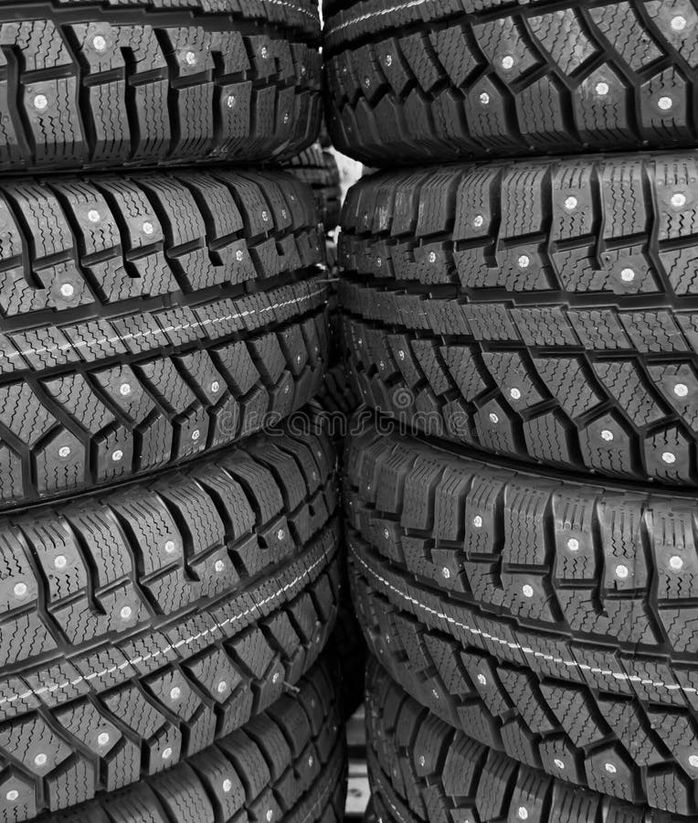 Winter Studded Tire. Winter Car Tires Background. Tire Stack Background ...