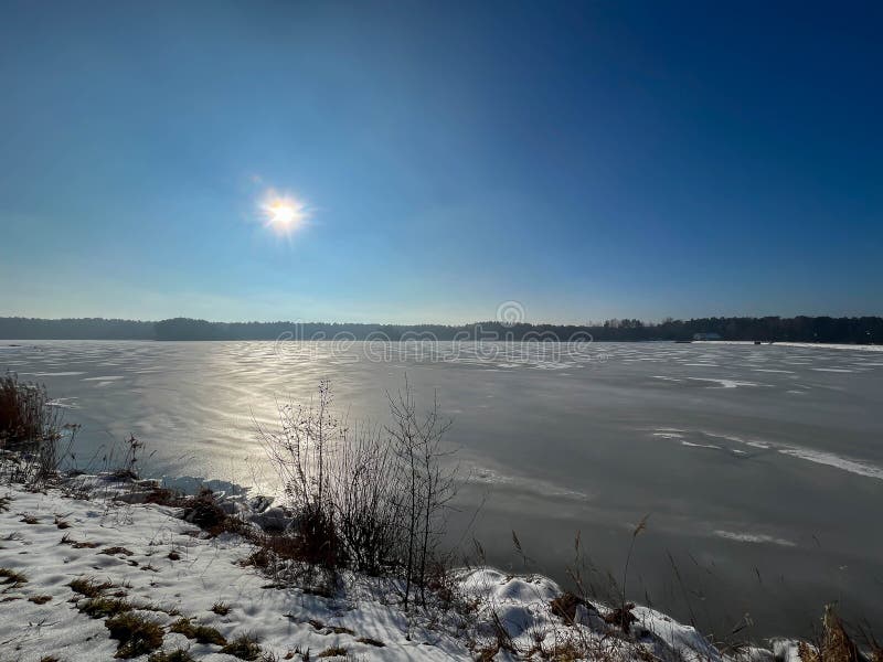 Winter Sun Over a Pond Covered in Ice and Snow Stock Photo - Image of ...
