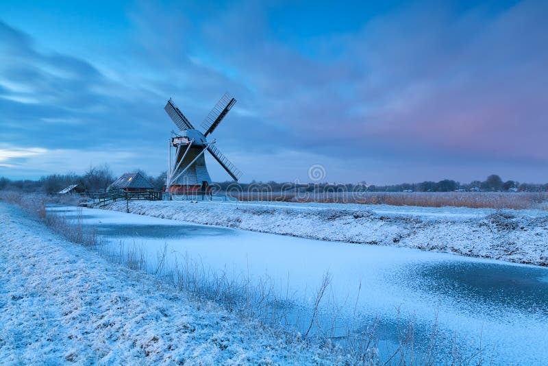 Windmill in the Snow stock photo. Image of farm, agriculture - 139962106