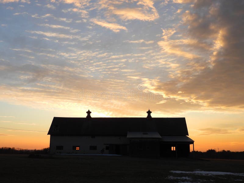 Winter Sunset Behind Silhouette of Large Historic Dairy Barn Stock ...