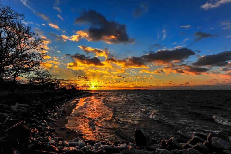 Winter Sunset on a Chesapeake Bay Beach Stock Photo - Image of cloudy ...
