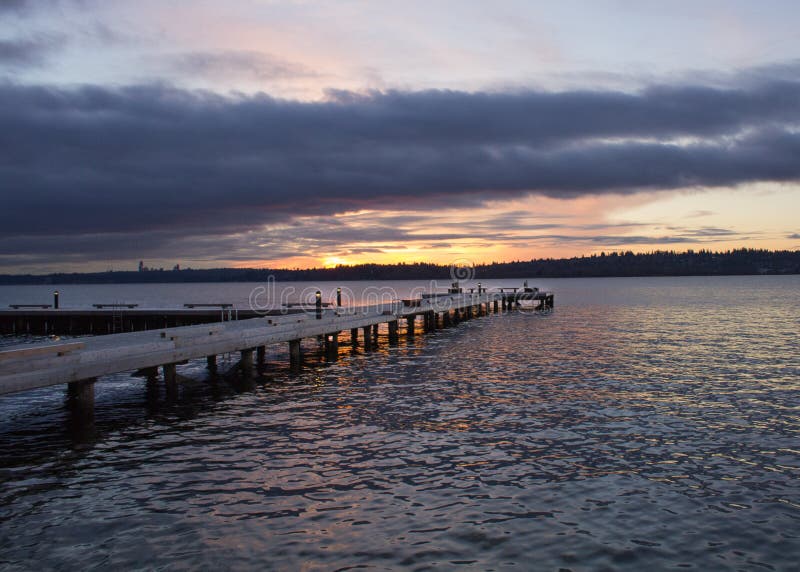 A Diagonal View Of A Pier On A Lake In A Winter Sunset At Waverly Beach ...