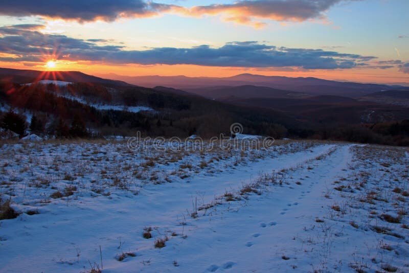 Winter Sunset stock image. Image of sunlight, rock, orange - 66395105