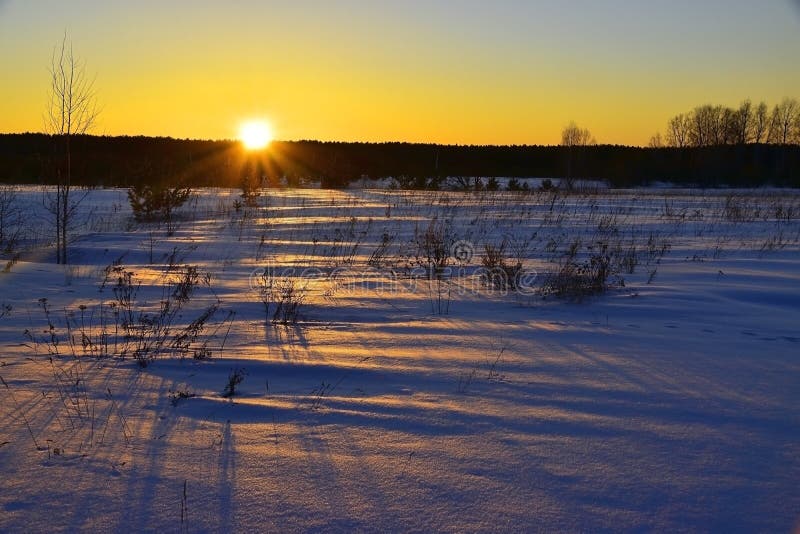 Winter Sunset Over Snowy Fields Stock Image - Image of horizon, winter ...