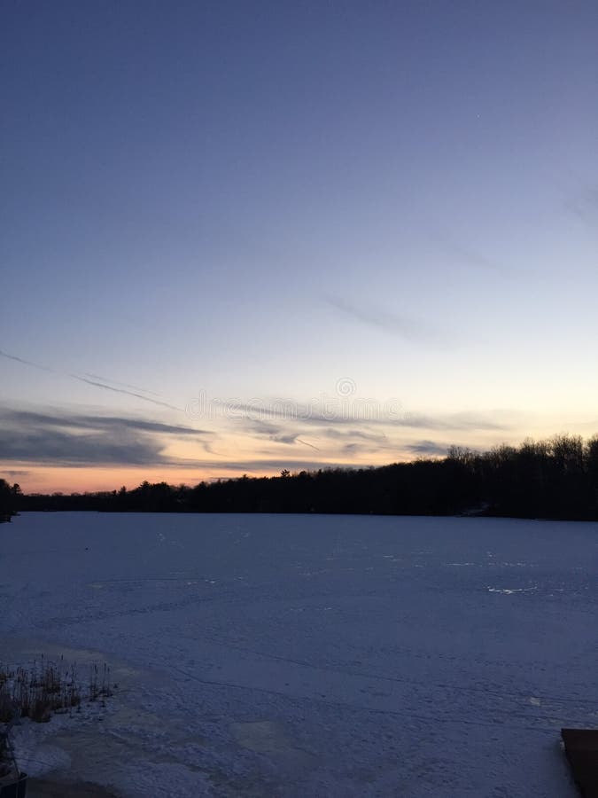 Winter Sunset on Snow Covered Lake Stock Image - Image of winter ...