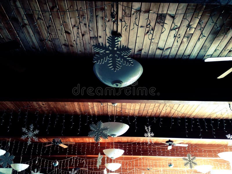 Winter Themed Decorations on a Wood Ceiling Stock Photo - Image of ...
