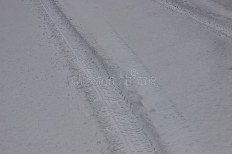 Winter Trail from a Car Wheel in the Snow, Close-up Stock Photo - Image ...
