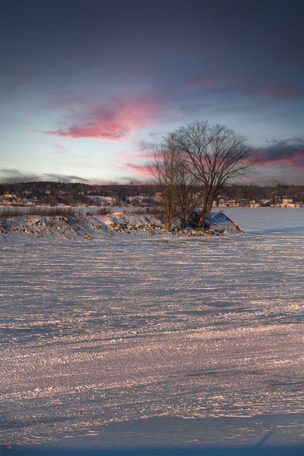 Winter View of the Quebec with a Sunset on the Frozen St. Lawrence ...