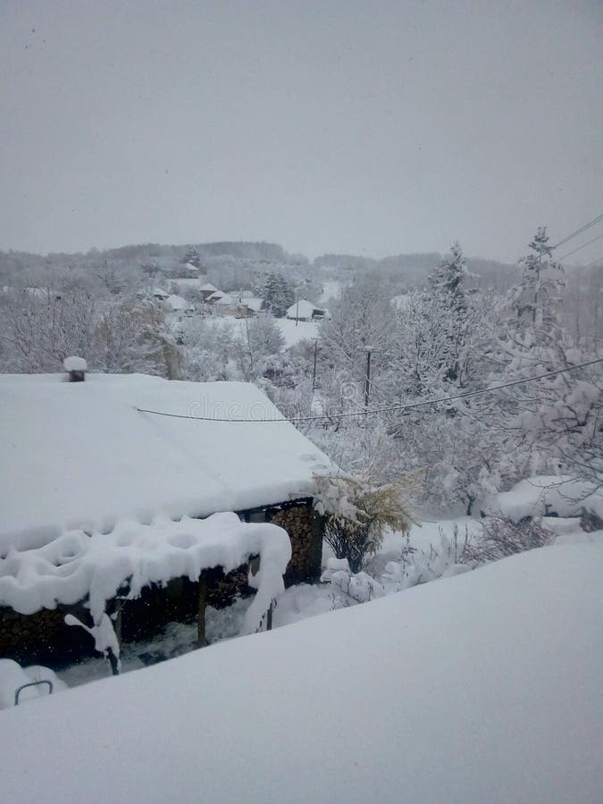 Winter in village in march stock image. Image of snow - 178450083