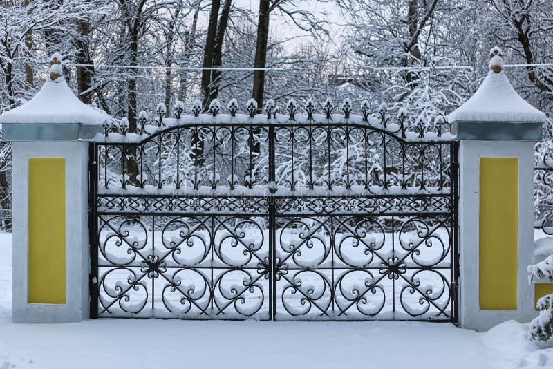 Snow-covered Iron Gates. Winter Wrought Fence Gates Stock Image - Image ...