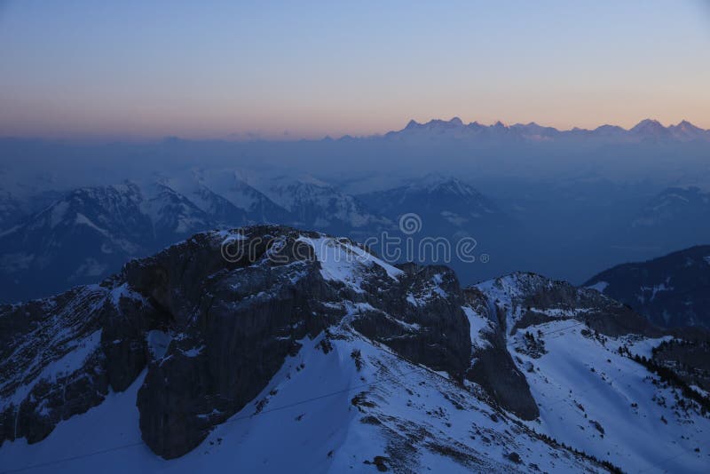 Wintery Sunset Scene in the Swiss Alps Stock Image - Image of cross ...