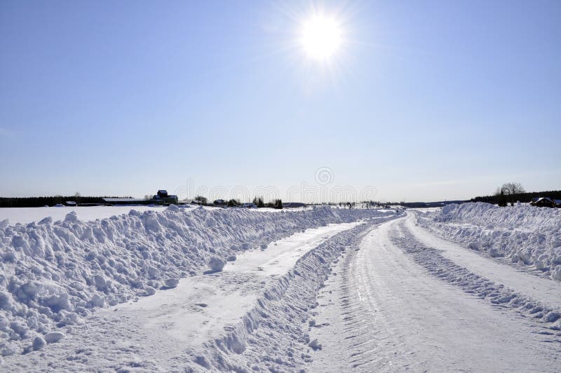 Wintry road and sun stock photo. Image of snow, white - 13281296