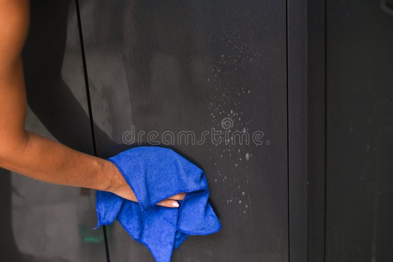 Wipe the Kitchen Cabinet with a Cloth. Wet Cleaning. Stock Image ...