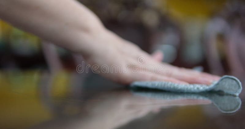 Wipe the Table with a Cloth Cleaning a White Table, Wearing an Apron ...