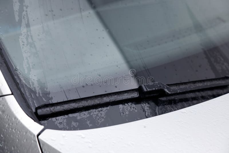 Wiper Cleaning Raindrops from Car Windshield, Closeup Stock Image ...