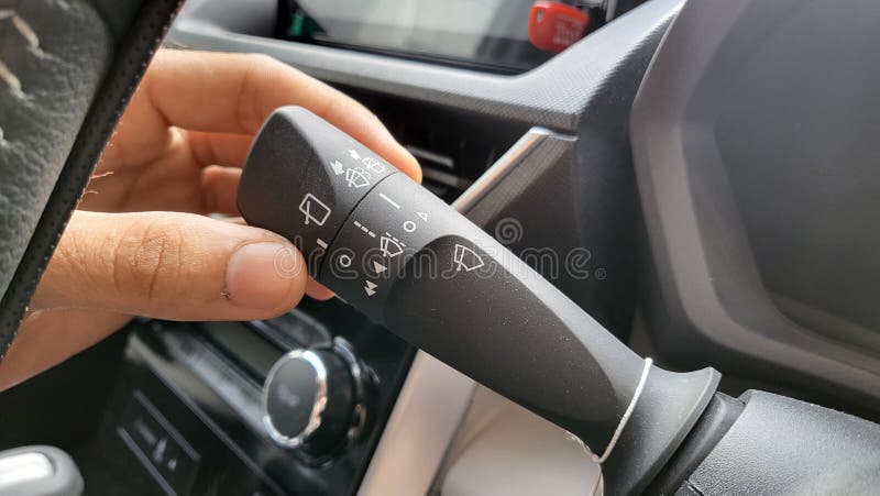 Wiper Control Button, an Asian Man S Hand is Operating the Wiper Switch ...