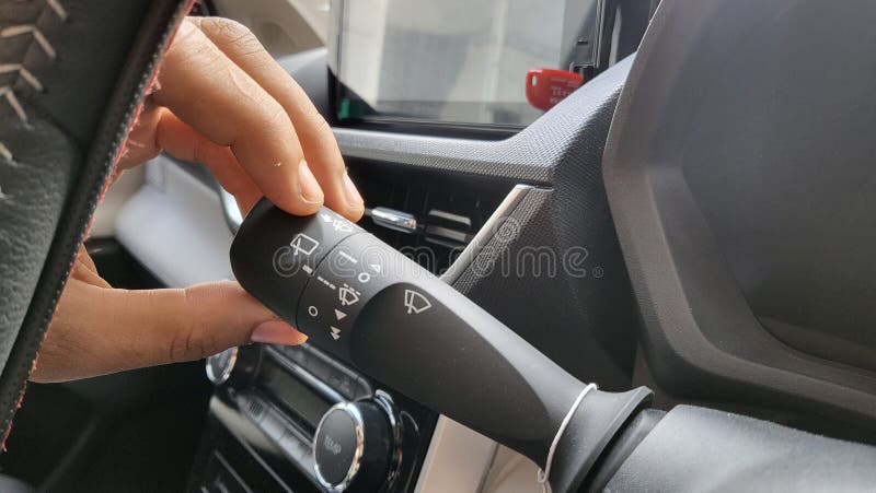 Wiper Control Button, an Asian Man S Hand is Operating the Wiper Switch ...