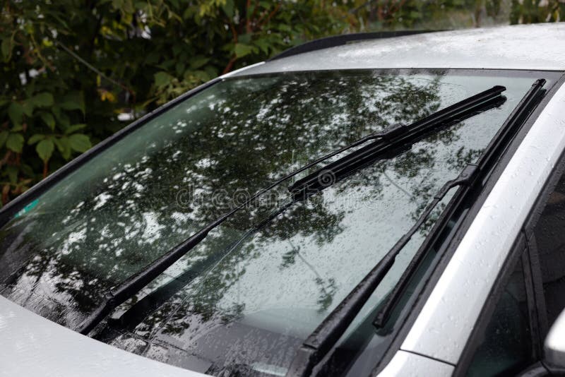 Wipers Cleaning Raindrops from Car Windshield Outdoors Stock Image ...