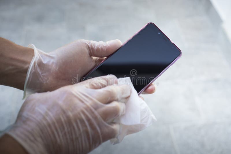 Wiping Smartphone Screen with Gloves on Stock Image - Image of handling ...