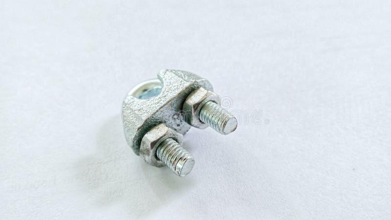 Wire Alternating Clamps on White Table, Steel Wire Clamp Stock Photo ...