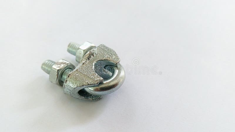 Wire Alternating Clamps on White Table, Steel Wire Clamp Stock Photo ...