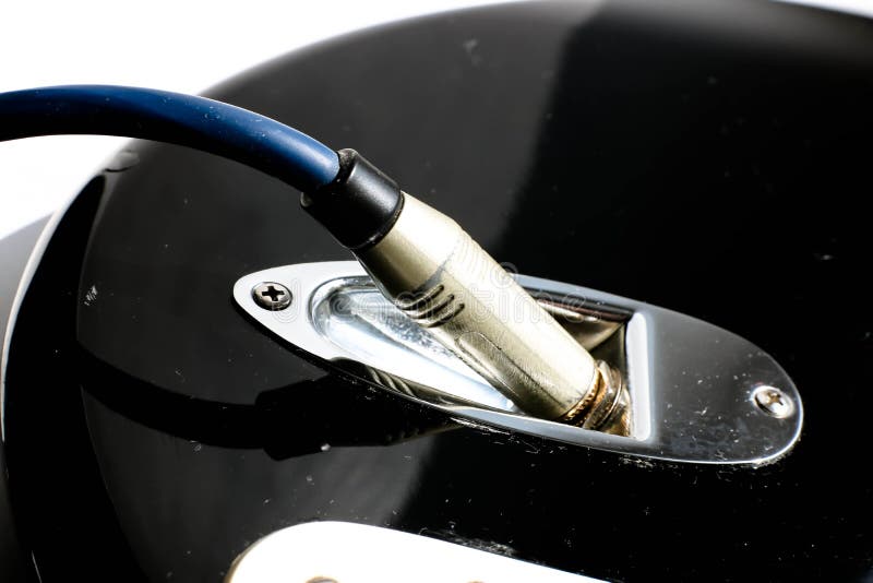 Wire Cable Jack Connected To Electronic Black and White Guitar. Stock ...