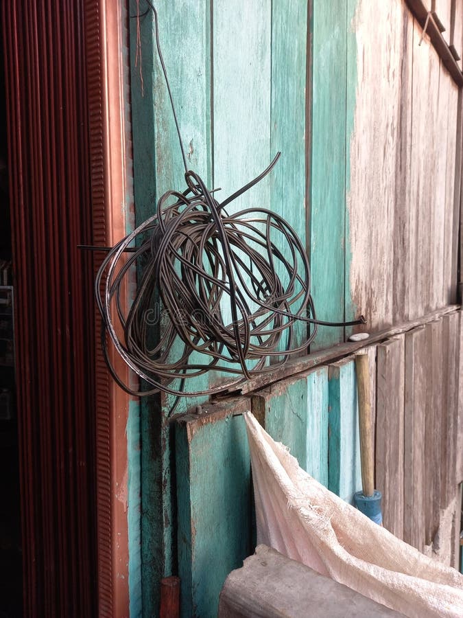 Wire that is Coiled and Then Hung on the Wall Stock Photo - Image of ...