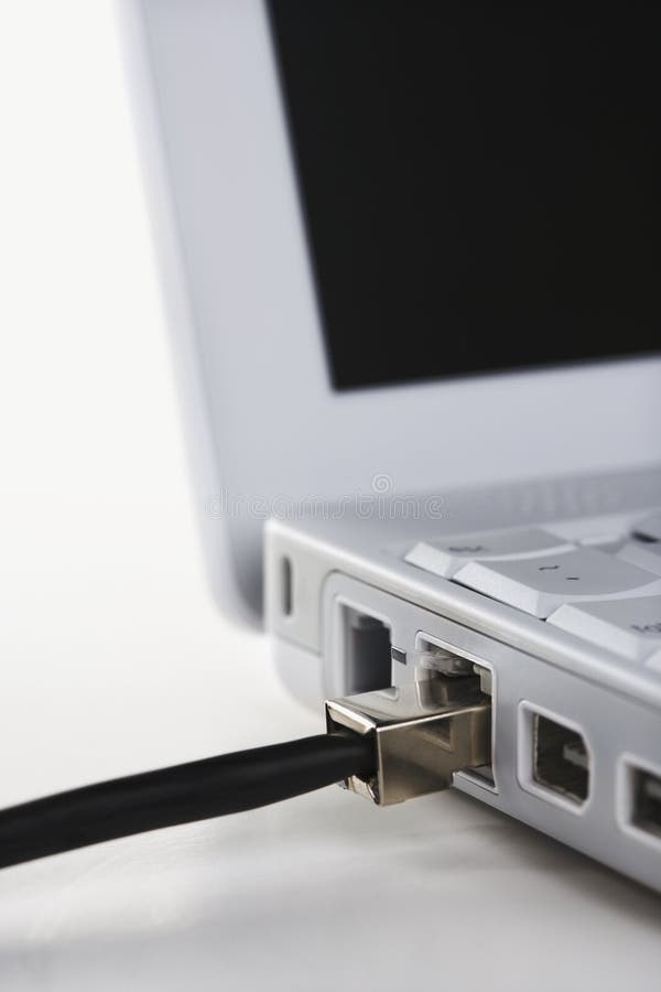 Wire connected to laptop stock photo. Image of vertical - 2045994