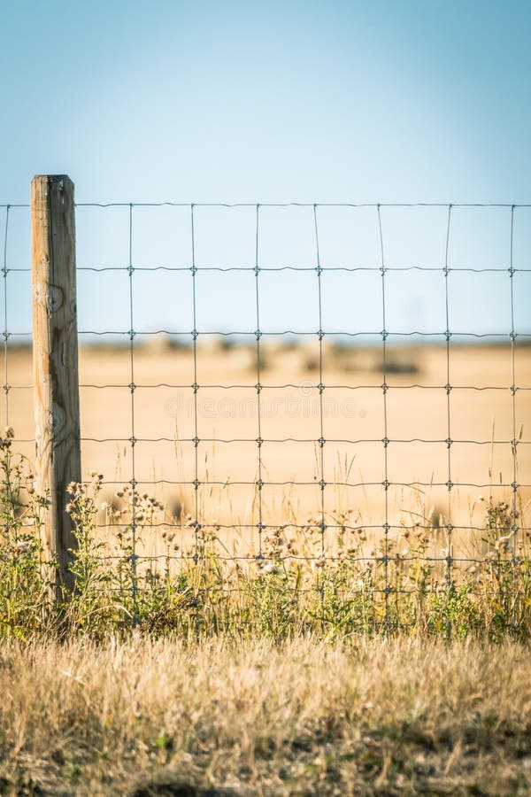 Wire Fence with Farm Fields Behind it Stock Image - Image of boundry ...