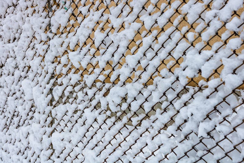Wire Fence Metallic Net with Snow. Metal Net in Winter Covered with ...