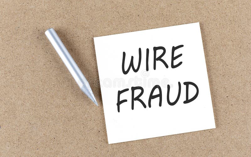 WIRE FRAUD Text on Sticky Note on a Cork Board with Pencil Stock Photo ...