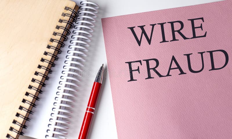 WIRE FRAUD Word on the Pink Paper with Office Tools on White Background ...
