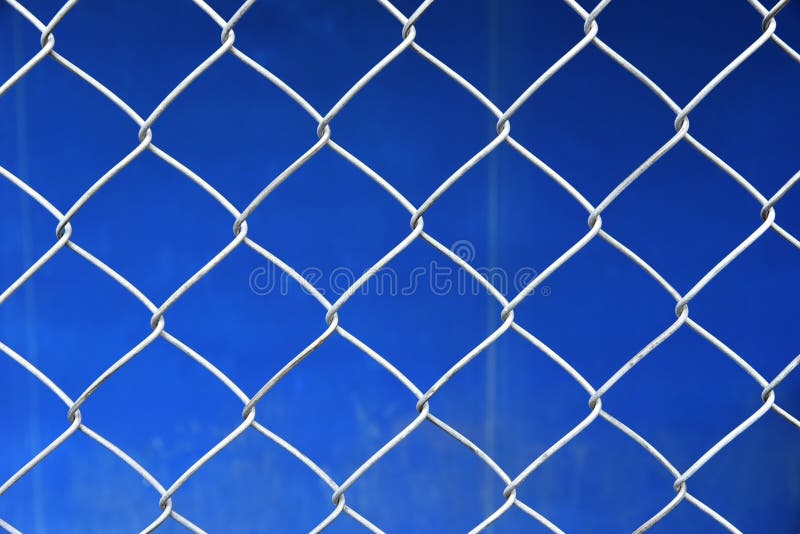 Wire Grid, Closeup of Chain Link Fence on Blue Sky Background Stock ...