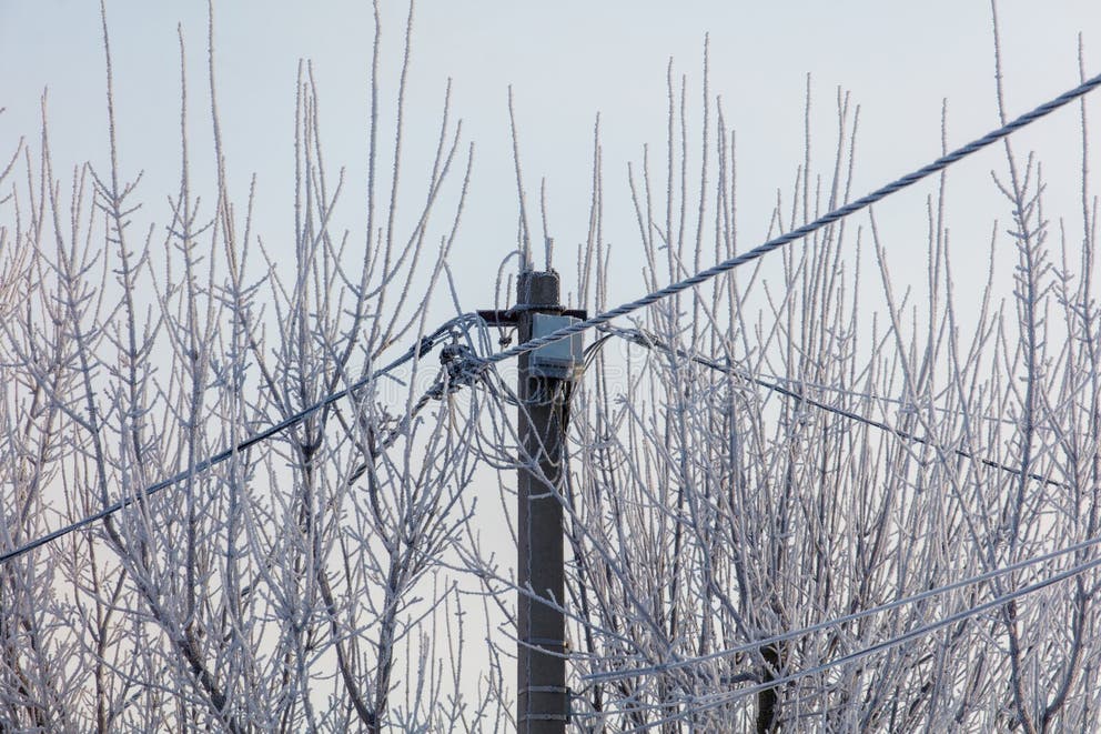 A Wire is Hanging from a Pole and is Covered in Snow Stock Image ...