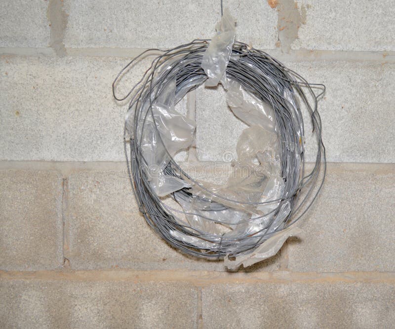 Wire hung on the wall stock photo. Image of outdoor, hard - 75635378