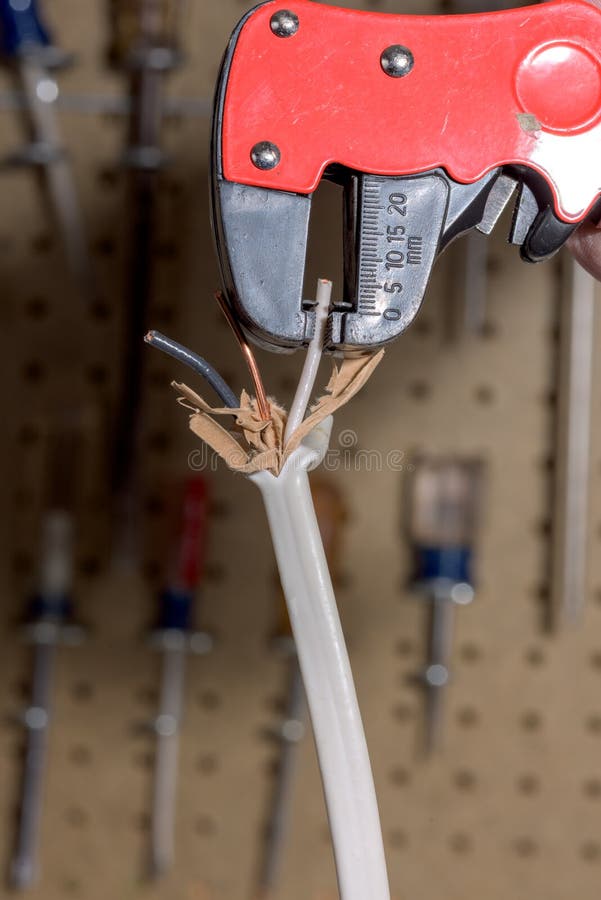 Wire Insulation Pulled Off with Strippers Stock Photo - Image of hands ...