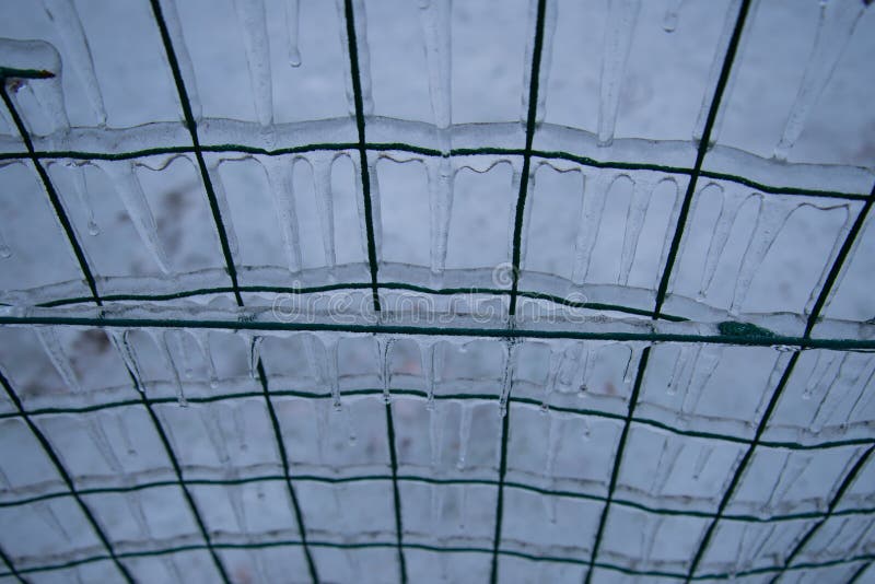 Wire mesh covered with ice stock photo. Image of pattern - 107219386
