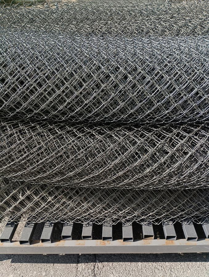 Wire Netting for the Fence Rolled on a Metal Base Stock Photo - Image ...