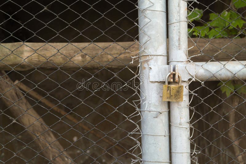 Wire Netting and Padlock stock image. Image of abstract - 127061681