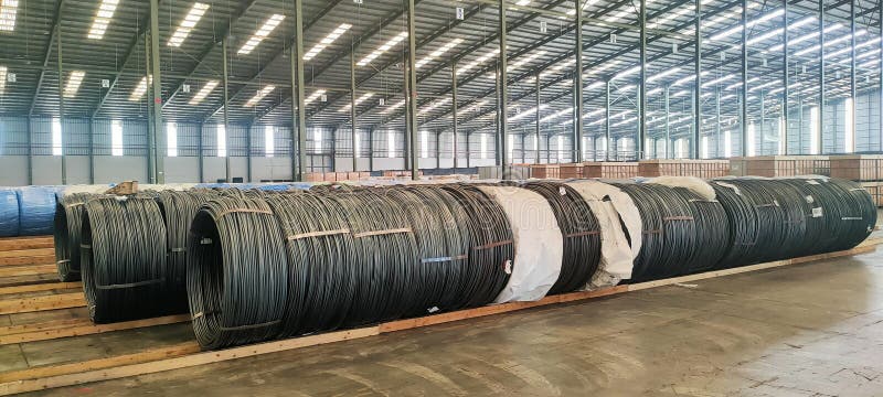 A Colection of Iron Rolls Arranged in a Warehouse Stock Image - Image ...