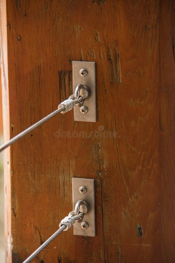 Wire Rope Fastened To a Wooden Post Stock Image - Image of attached ...