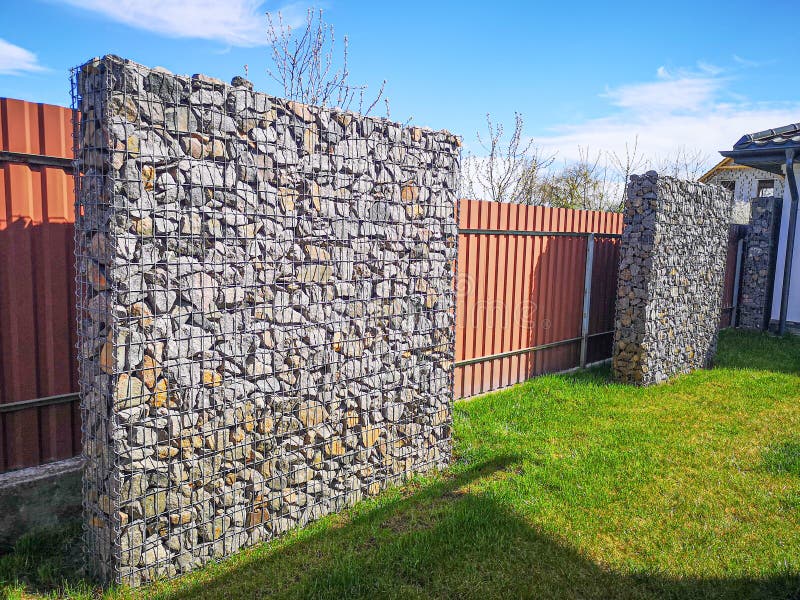 Wire and Stone Fence. Decorative Building Made of Stone Gabion Stock ...