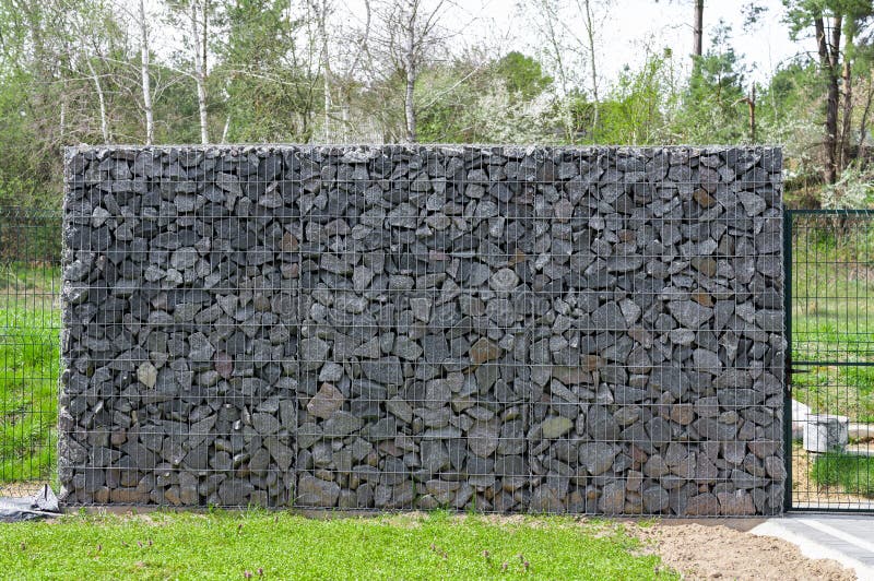 Wire and Stone Fence. Decorative Building Made of Stone Gabion Stock ...