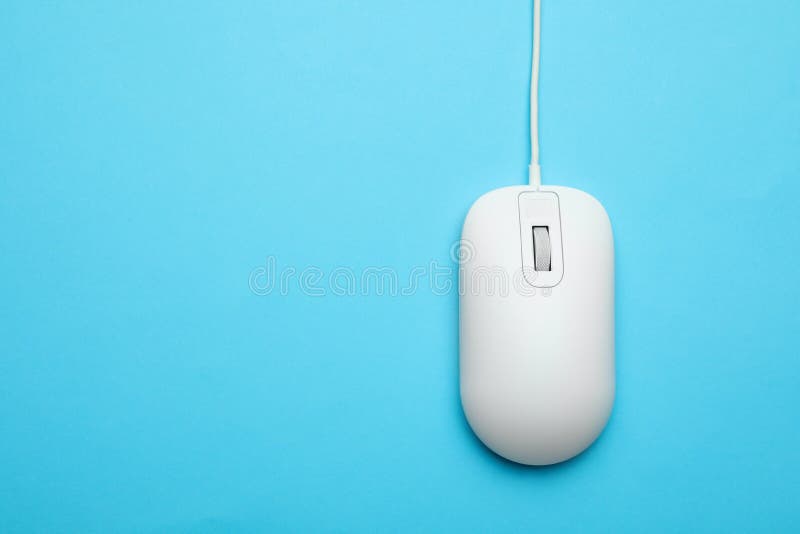 Wired Computer Mouse on Light Blue Background. Space for Text Stock ...